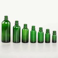 China Green Essential Oil Glass Dropper Bottles 5ml 15ml 100ml Low Borosilicate Glass for sale