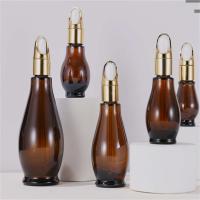 China Amber Glass Essential Oil Bottles with Roller Ball 30ml 50ml Borosilicate Glass for sale