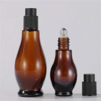 China Amber Glass Essential Oil Bottles with Roller Ball 30ml 50ml Borosilicate Glass for sale