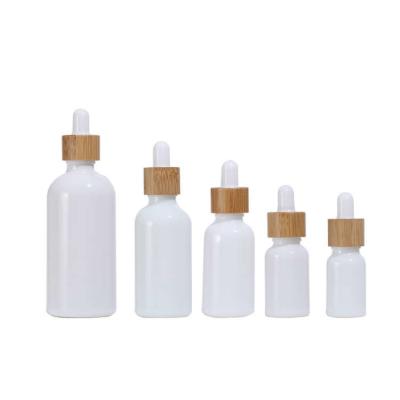 China CE Bamboo Glass Dropper Bottles 10ml 30ml Portable Cosmetic Glass Bottle with Bamboo Dropper for sale