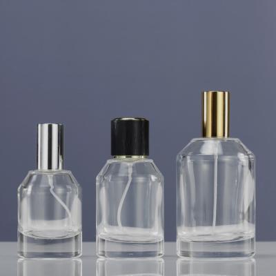 China Lidded Empty Perfume Spray Bottle 30ml 50ml 100ml Crystal Glass OEM for sale