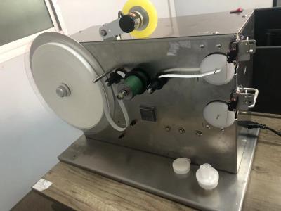 China Semi-Automatic HME Filter Tape Winding Machine with ±0.2mm Labeling Error Allowance and Cutting for sale