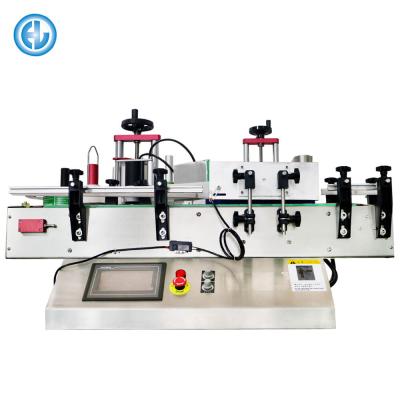 China APPAREL label applicator sticker labeling machine adhesive semi automatic labeler machine round the small bottle tabletop semi-automatic gun for sale