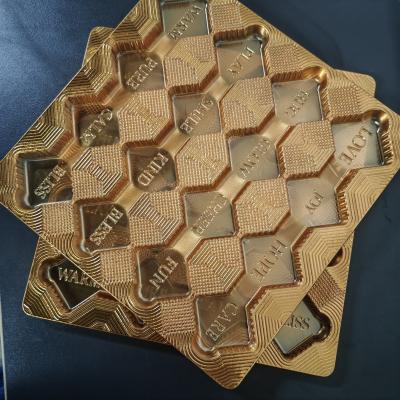 China Customized disposable gold 16 compartment PET chocolate container with logo for sale