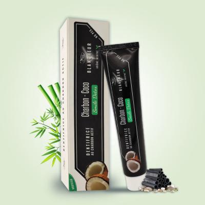 China Oral Care Black Activated Charcoal & Organic Coconut Oil Teeth Whitening Toothpaste for sale