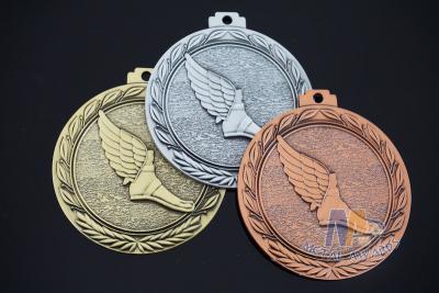 China 3d Effect Custom Engraved Medals With Antique Gold Silver Copper Plating for sale