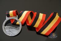 China Custom Zinc Alloy Sports Medal 50mm Cut Out Design with Strip Ribbon Antique Silver for sale
