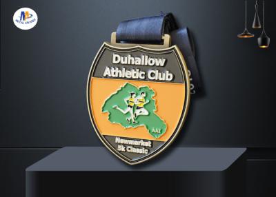 China Custom Egg Shape Sports Medals Antique Gold Plating 65mm 3mm for 5K Running Clubs for sale
