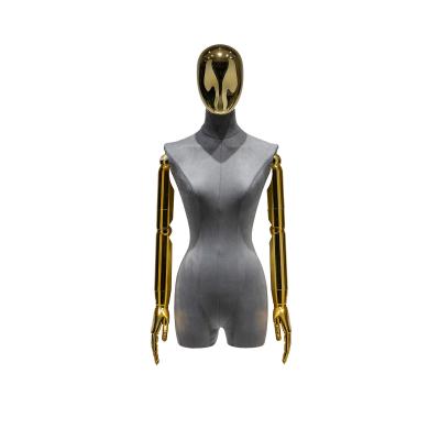 China Female mannequin with a gold plated arm and a half body covering for sale