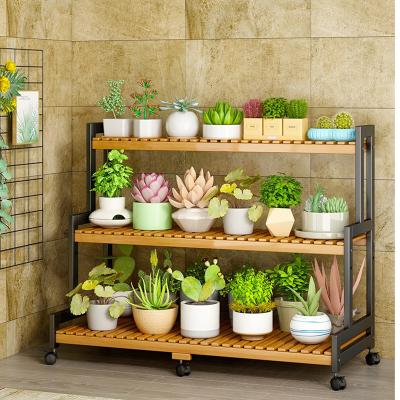 China Indoor Multilayer Storage Rack Bamboo Flower Pot Display Stand with Ladder Style for Garden Balcony for sale