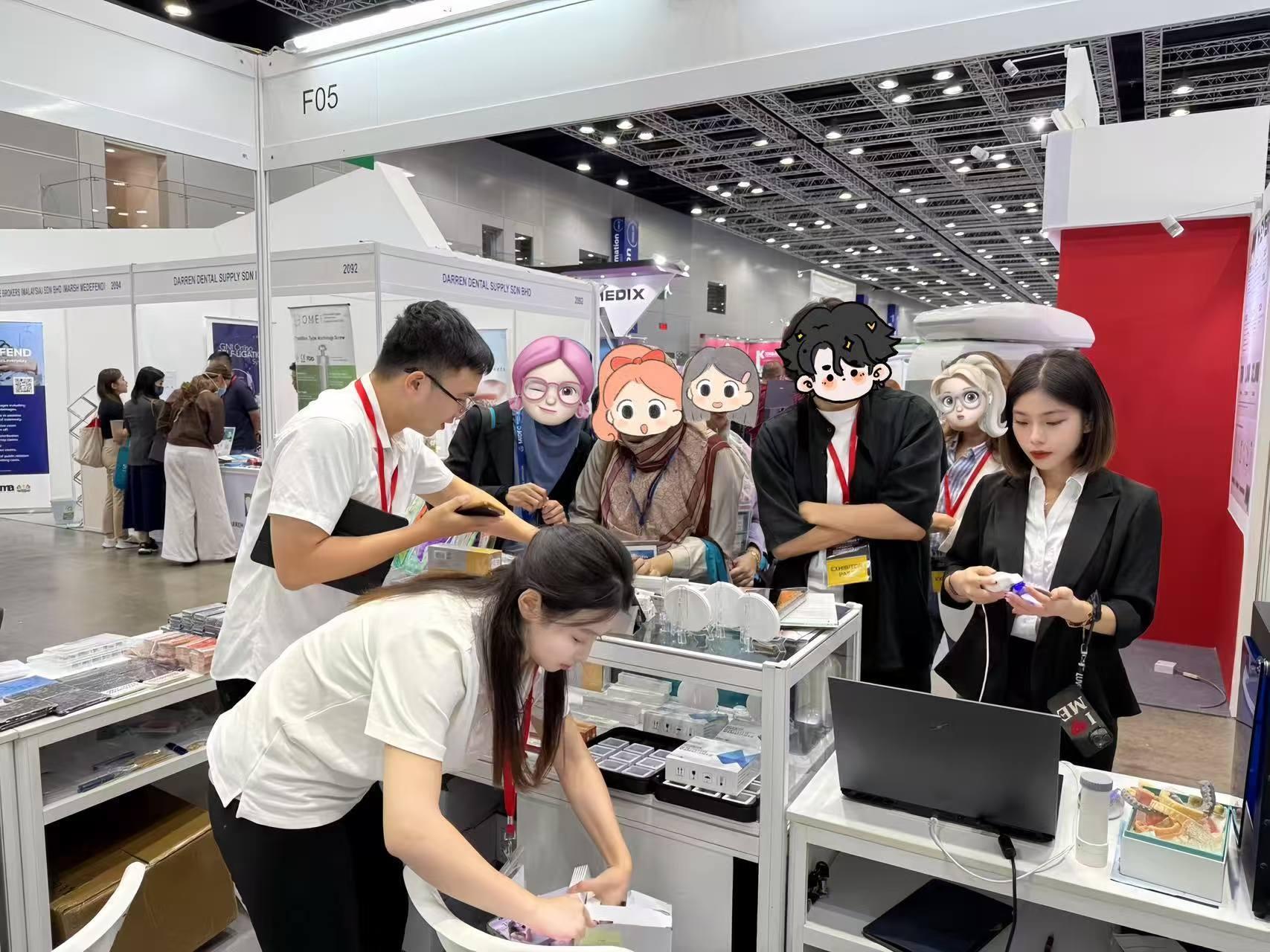 Busy exhibition booth with visitors