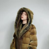 China Fashion Retail Women'S Fluffy Hood Faux Fur Coat Long Overcoat for sale