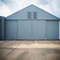 China Q235 Steel Sliding Aircraft Hangar Doors Heavy Duty Construction Large Opening Capacity for sale