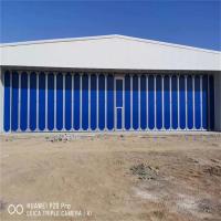 China Heavy Duty Vertical Design Fold Up Hangar Doors Space Saving For Industrial Facilities for sale