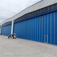 China Heavy Duty Vertical Design Fold Up Hangar Doors Space Saving For Industrial Facilities for sale