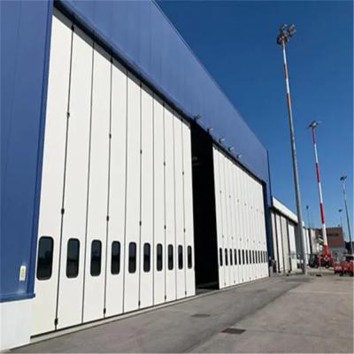 China Large Multi Leaf Folding Industrial Door Wide Span Fold Up Hangar Door Weather Sealing for sale