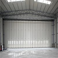 China Windproof Large Span Folding Hangar Door Corrosion Resistant Industrial Bi Fold Door for sale