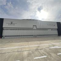 China Vertical Steel Bifold Hangar Doors High Tensile Structural Design CE Marked for sale
