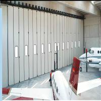 China Windproof Large Span Folding Hangar Door Corrosion Resistant Industrial Bi Fold Door for sale