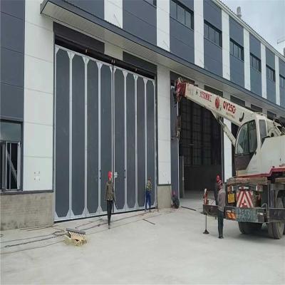 China Heavy Duty Multi Panel Aircraft Hangar Door Industrial Bifold Hangar Doors Space Saving for sale