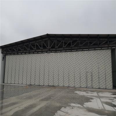 China OEM Metal Bi Folding Doors Windproof Exterior Industrial Doors Low Maintenance for sale