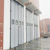 China Customizable Width Industrial Folding Door Heavy Duty Steel Bifold Door Powder Coated for sale