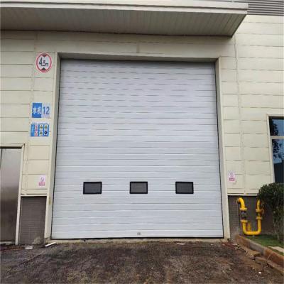China Thermal Insulation Industrial Sectional Door Quiet Operation Steel For Warehouses for sale