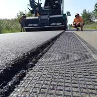 China Bitumen Coated Fiberglass Geogrid Pavement Crack Resistance Reinforcement Mesh for sale