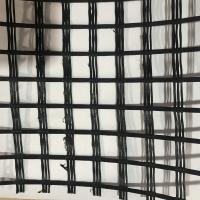 China Bitumen Coated Fiberglass Geogrid Pavement Crack Resistance Reinforcement Mesh for sale