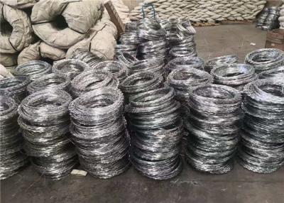 China Ss Barbed Punched Tape Razor Wire Concertina Coil for sale