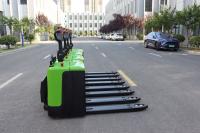 China 1550mm Fork Battery Powered Pallet Truck with 2-Ton Capacity and 24V/210AH Battery for Food & Beverage Industry for sale