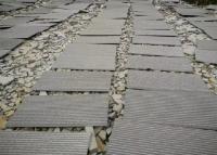 China Hainan Black Lava Sands Blasted Bluestone Black Dark Basalt Flamed Grooved Natural Stone Tiles Slabs for sale