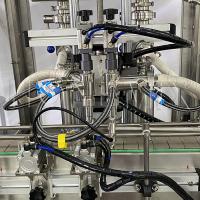 China Heated Vaseline Cream Filling Machine Two Nozzle Capping Sealing Labeling Line for sale