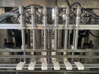 China Cosmetics Cream Lotion Filling Machine Six Nozzles Filling Capping  Machine for sale
