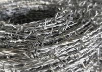 China Hot Dipped Galvanized Steel Barbed Wire 1.5-3cm Barb Length 7.5-15cm Spacing Farm Prison Fence for sale