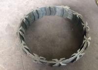 China Heavy Zinc Coating BTO-60 Concertina Razor Barbed Tape Wire 0.6mm Blade 2.5mm Wire for sale