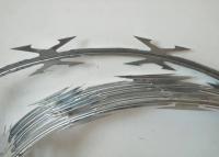 China Heavy Zinc Coating BTO-60 Concertina Razor Barbed Tape Wire 0.6mm Blade 2.5mm Wire for sale