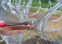 China PVC Powder Coated CBT 65 Razor Wire Anti Climb Concertina Barbed Wire Coils 0.6mm Blade 2.5mm Core for sale