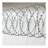 China Hot Dipped Galvanized Concertina Razor Wire Coil 450mm 33 Loops Security Fence for sale