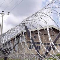 China Hot Dipped Galvanized Concertina Razor Wire Coil 450mm 33 Loops Security Fence for sale