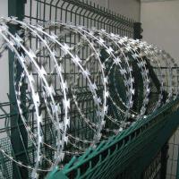 China Hot Dipped Galvanized Concertina Razor Wire Coil 450mm 33 Loops Security Fence for sale