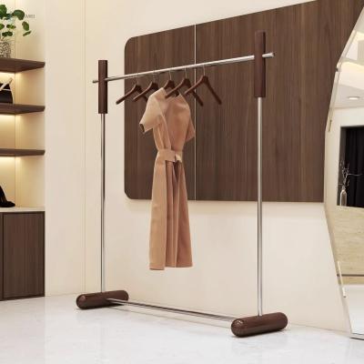 China Stainless Steel Walnut Bright Middle Island Rack Women's Clothing Floor Hanger Store Display Prop for sale