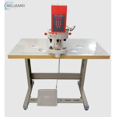 China Automatic Electric Computer-controlled Anti-strike Hand Nail Buckle Machine Large White Buckle Machine. for sale