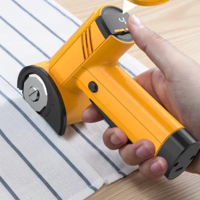 China Handheld Automatic Electric Scissors  Cloth Cutting Machine for sale