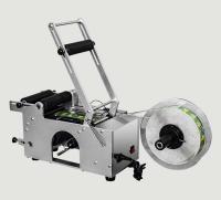 China Small Manual Round Bottle Labeling Machine Desktop Adhesive Labeler for Plastic Glass Bottles for sale