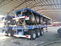 China 12R225 Tubeless Tires Flat Bed Semi Trailer Mechanical Suspension Heavy Duty Steel Flatbed Trailer for Cargo Transport for sale