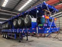 China Overall Dimension 12500mm 2500mm 1530mm Flat Bed Semi Trailer Equipped with 12 Wheels Transporting Large Heavy Goods for sale