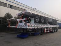 China 12R225 Tyre Flat Bed Semi Trailer 3 Axles Strong Frame Trailer Perfect for Transporting Oversized Equipment and Materials for sale