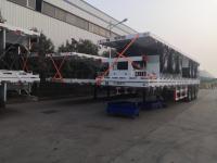 China 12R225 Tyre Flat Bed Semi Trailer 3 Axles Strong Frame Trailer Perfect for Transporting Oversized Equipment and Materials for sale