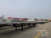 China Load 20ft 40ft Container Trailer Flat Bed Semi Trailer Including 1 Standard Tool Box and 3.5in JOST King Pin Ideal for Freight Hauling for sale